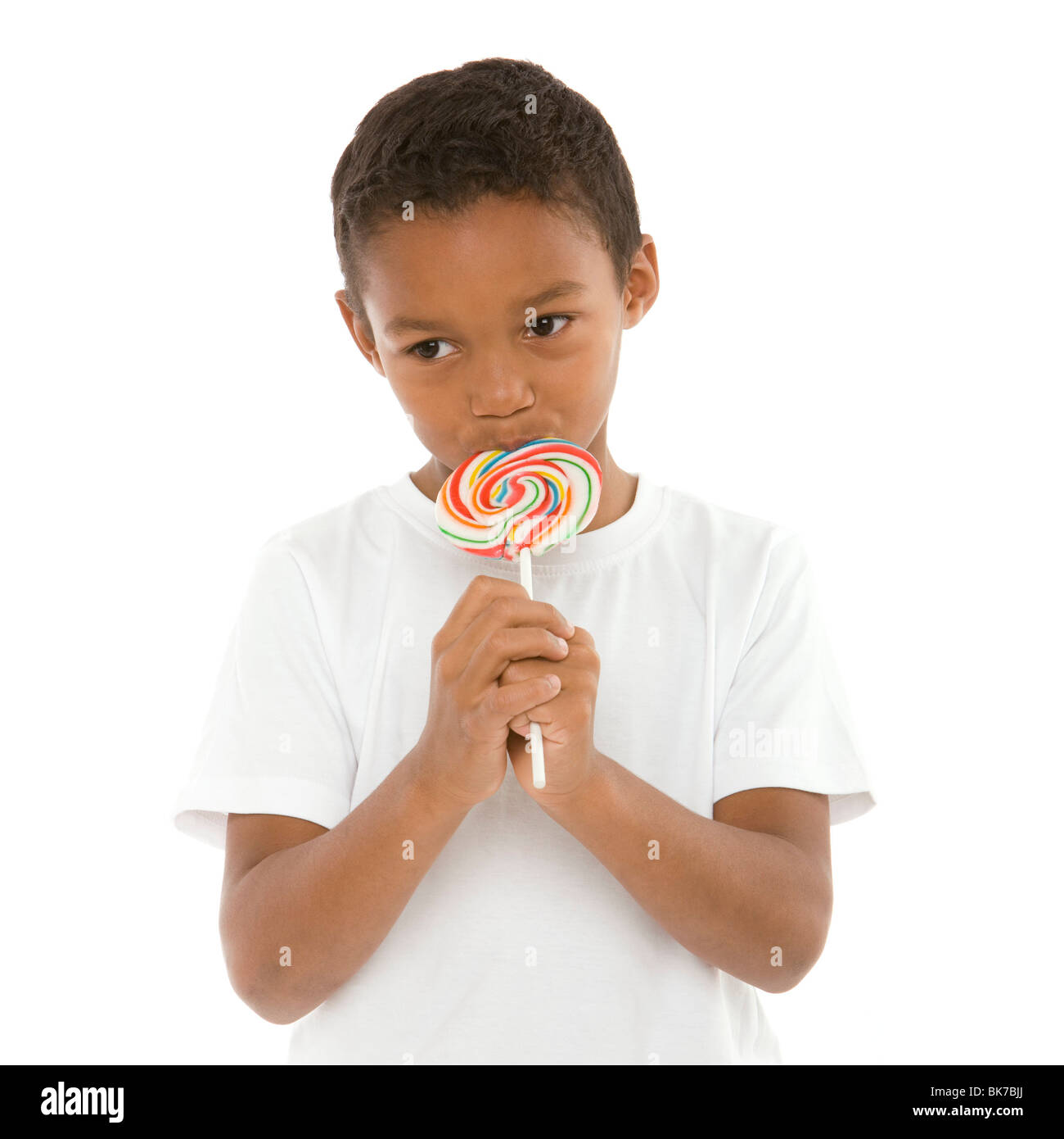 Boy eating a lollipop Stock Photo - Alamy