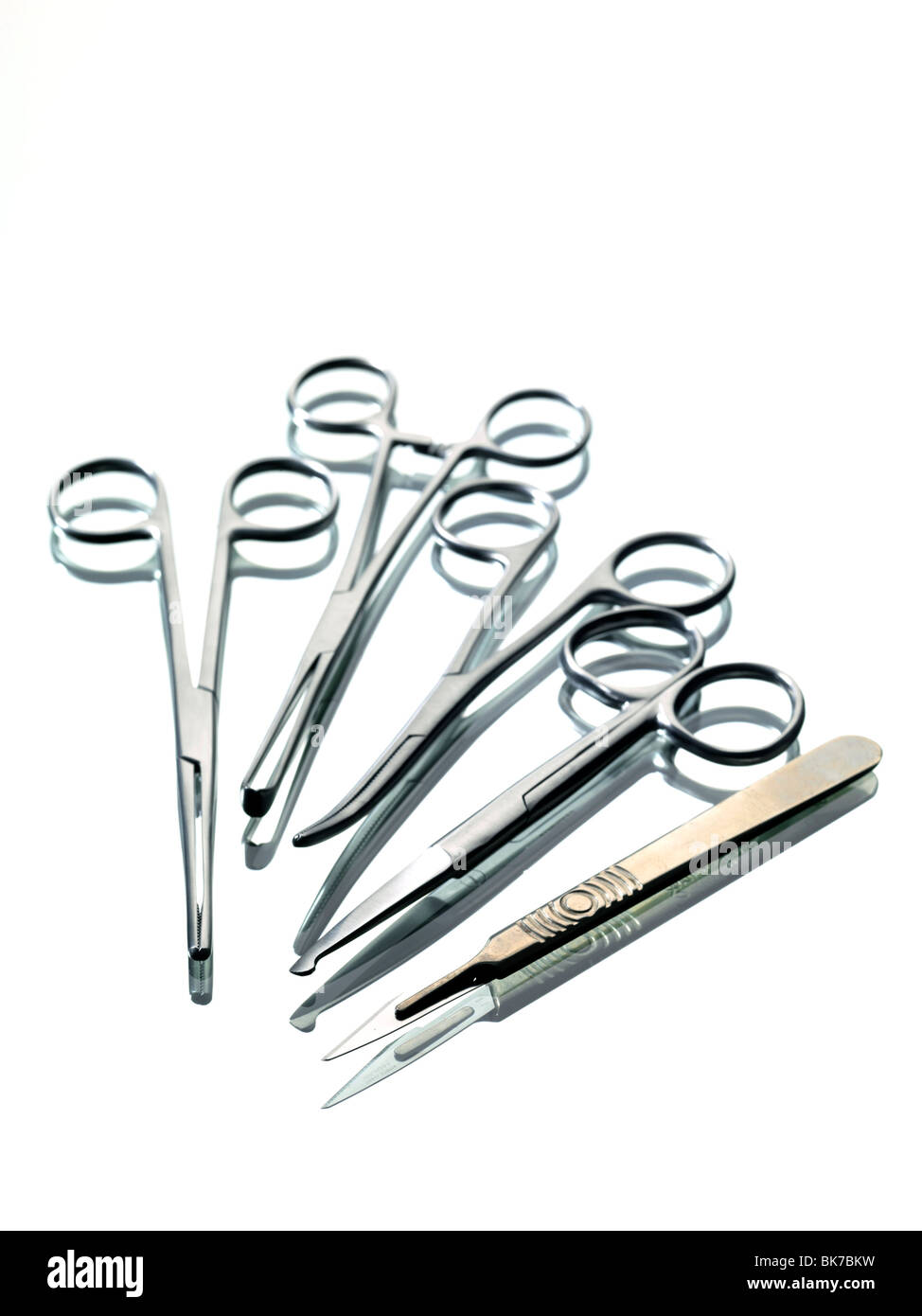 Forceps and scalpel Stock Photo - Alamy