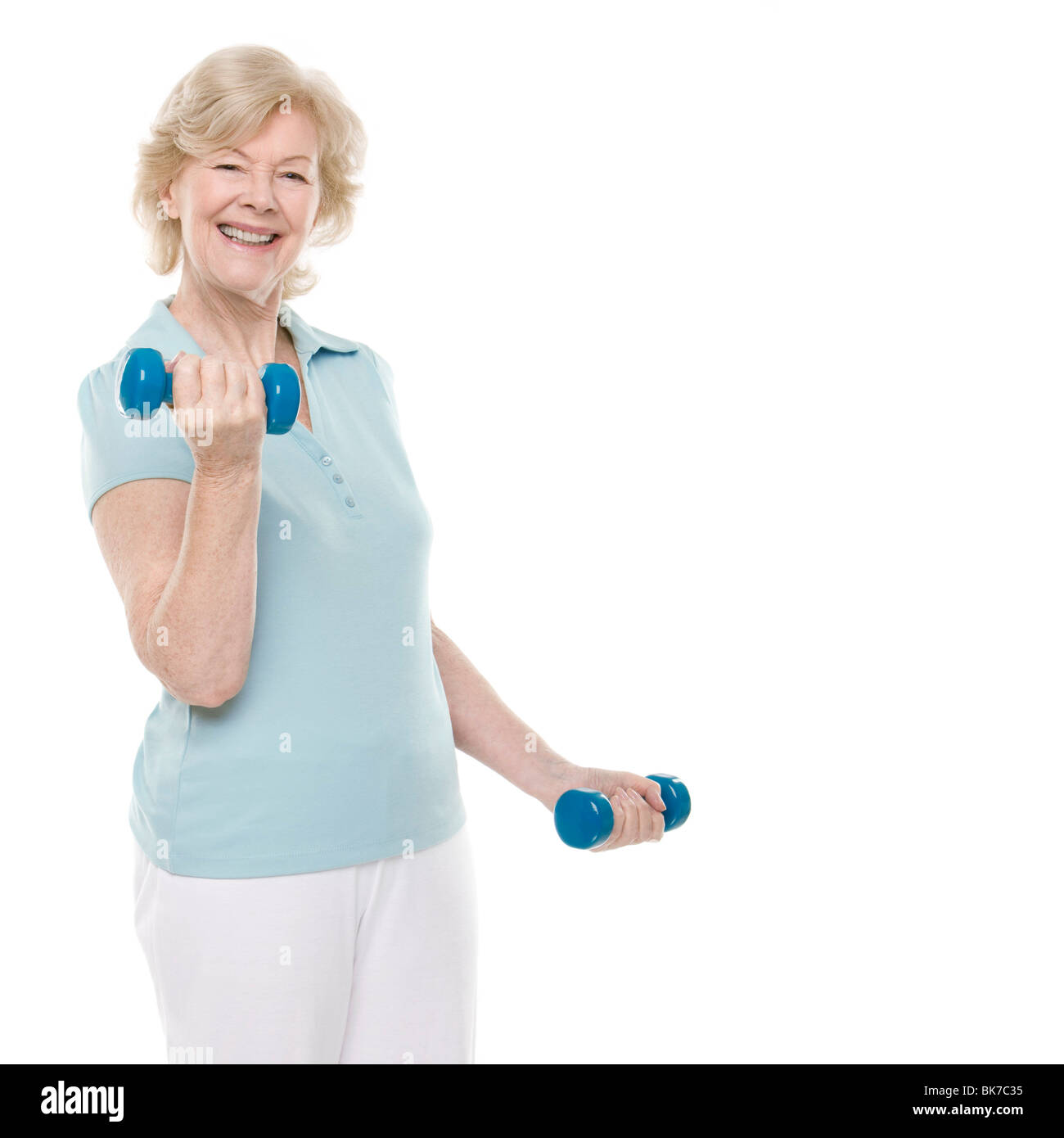 Senior woman lifting weights Stock Photo - Alamy
