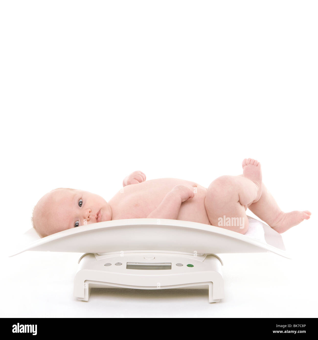 Baby being weighed Stock Photo - Alamy