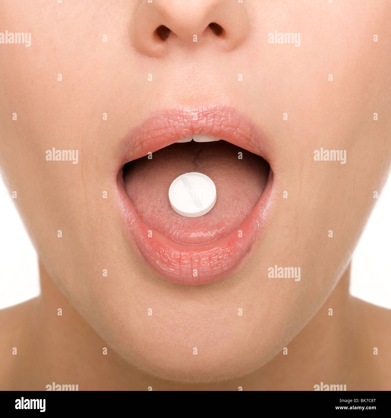 Taking a tablet Stock Photo - Alamy