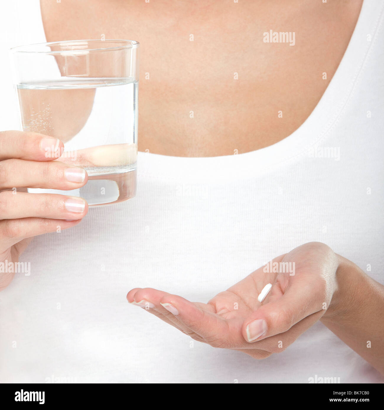 Taking a tablet Stock Photo - Alamy