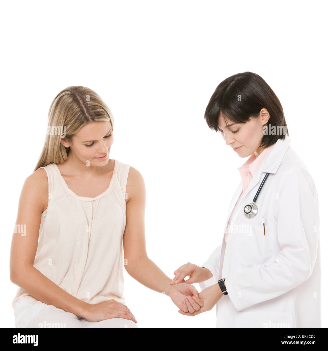 Doctor checking pulse Cut Out Stock Images & Pictures - Alamy
