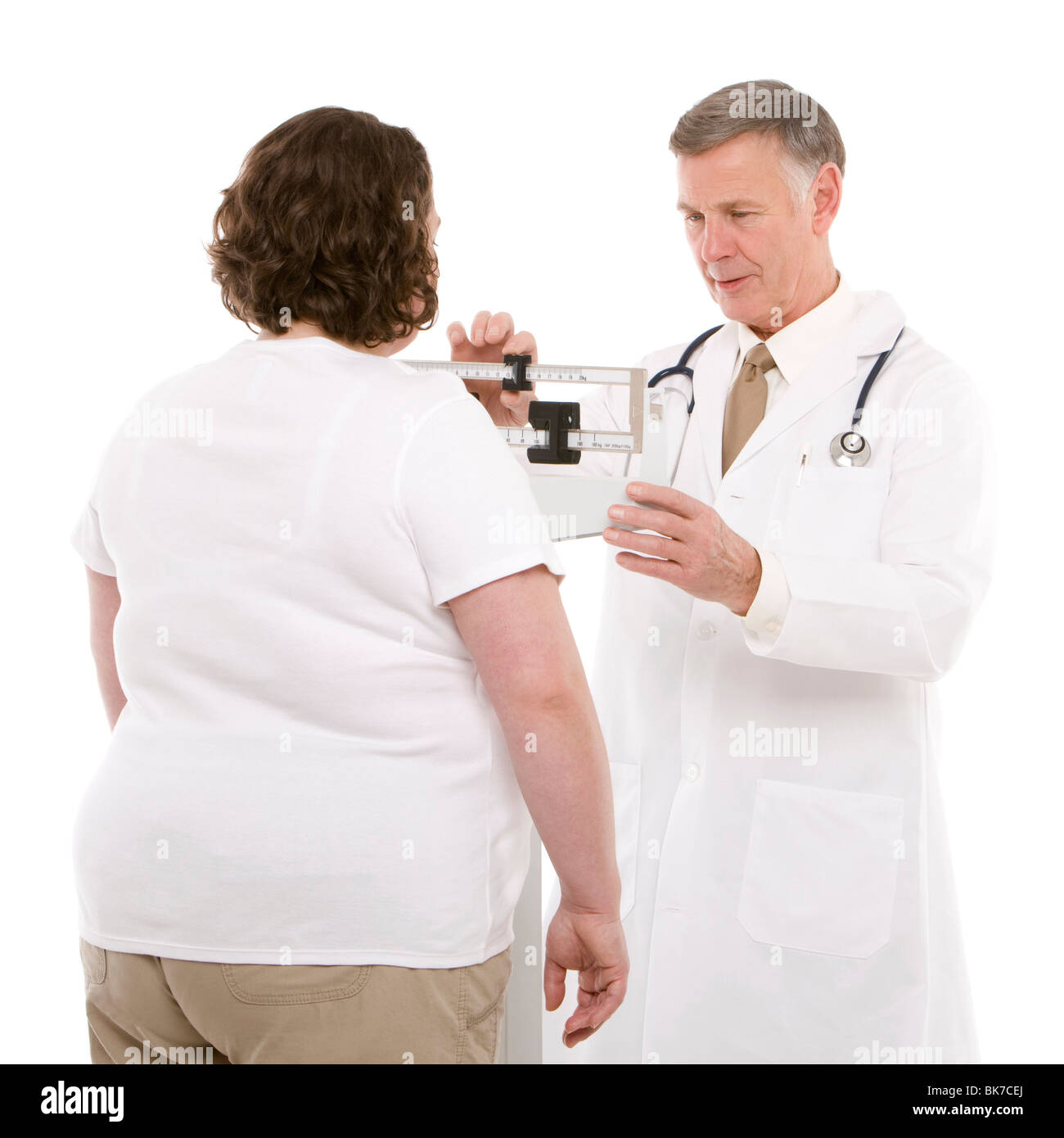 Overweight woman being weighed Stock Photo - Alamy