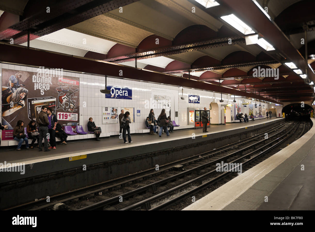 People waiting for the metro at the Opera station platform; Paris ...