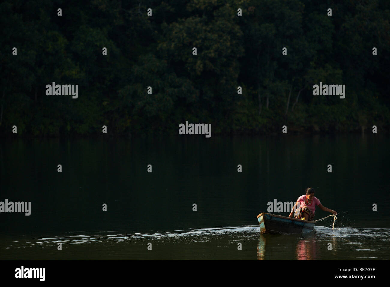 A woman fishes on Begnas Lake near Pokhara, Nepal on Tuesday October 27 ...