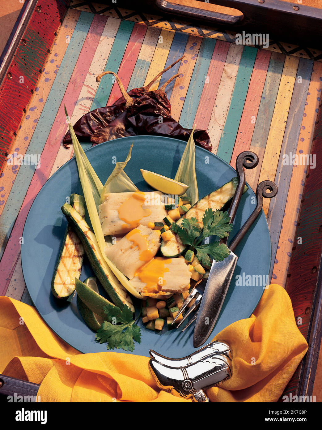 Tamales, roasted zucchini, funky flatware, silver boot napkin ring and ...