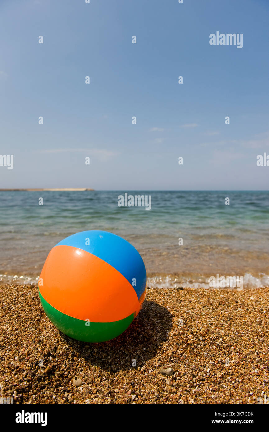 colorful beach ball on nature coast landscape Stock Photo - Alamy
