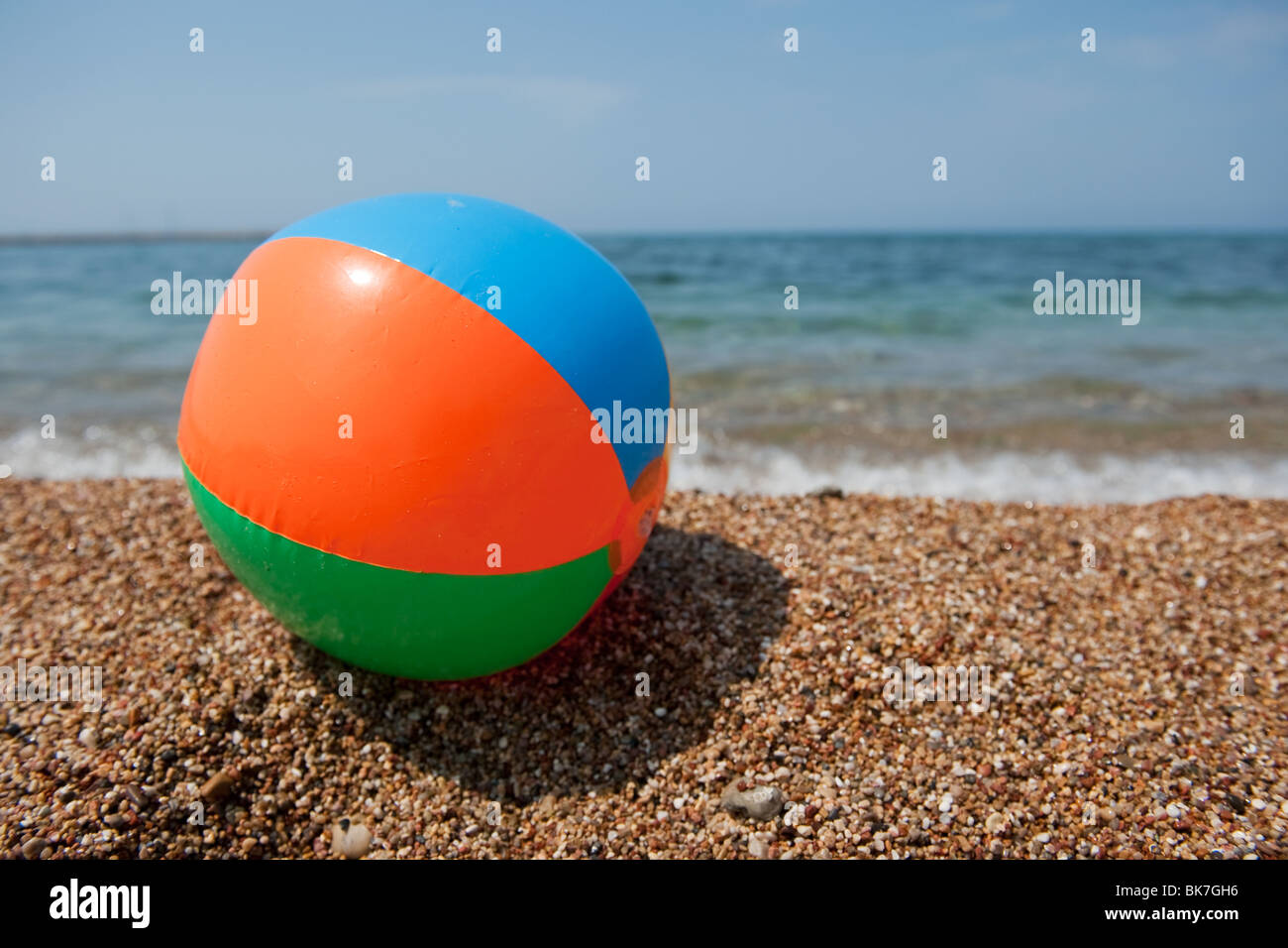 Beach ball on beach near the sea Stock Photo - Alamy