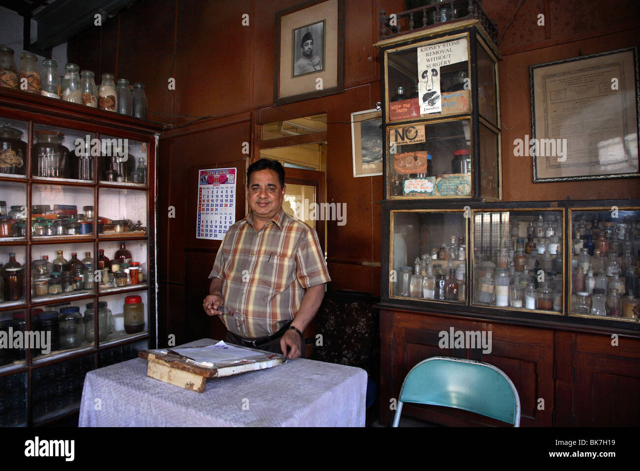Unani Doctor who practises ancient Islamic medicine, in his clinic ...
