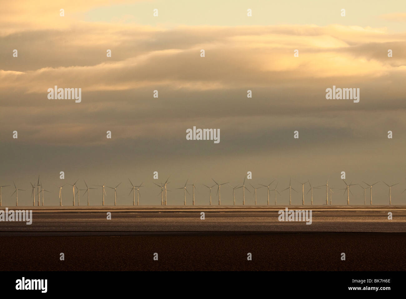 A view of an offshore wind farm under a cloudy sky Stock Photo - Alamy