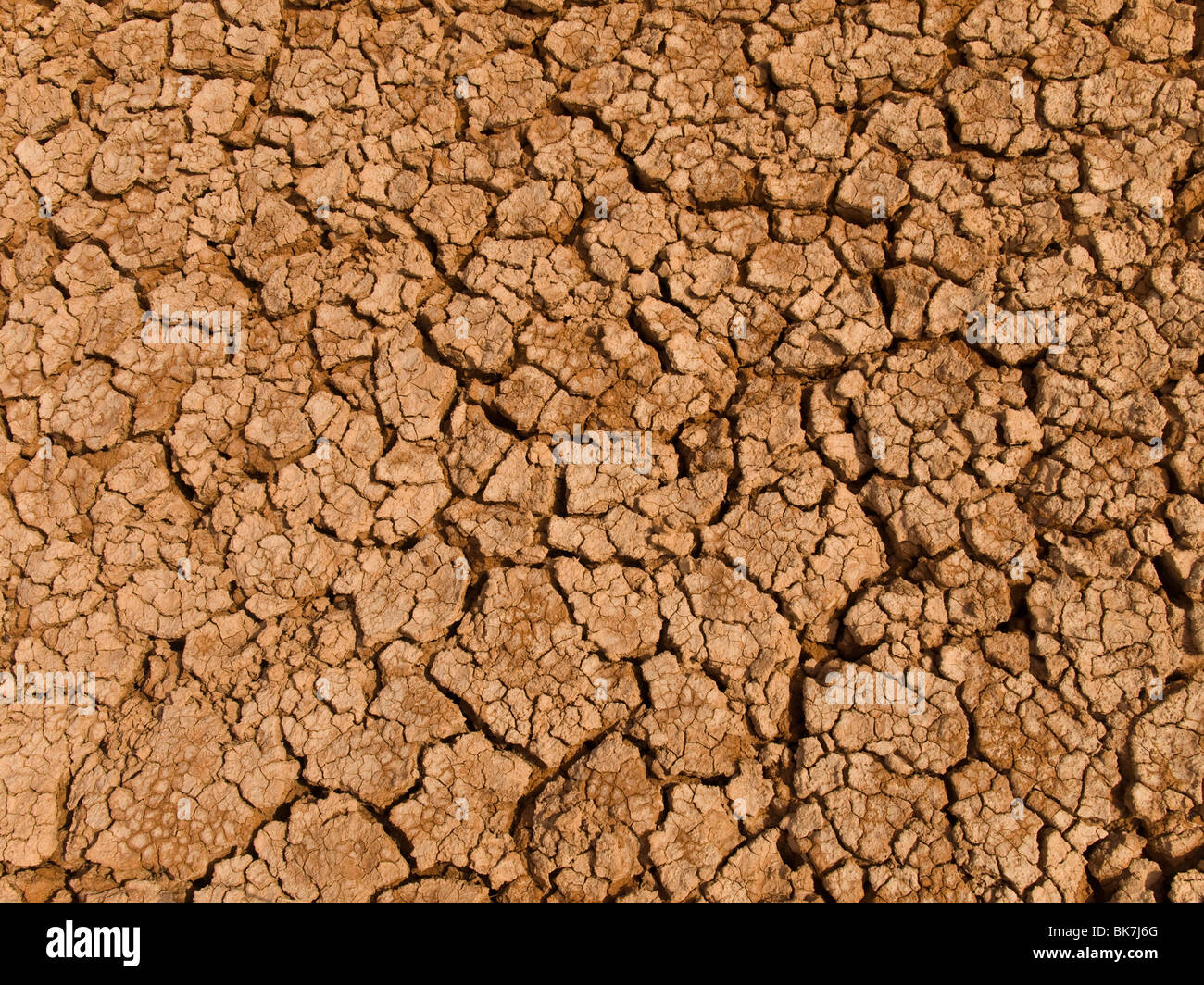 A baked earth soil after a long drought Stock Photo - Alamy