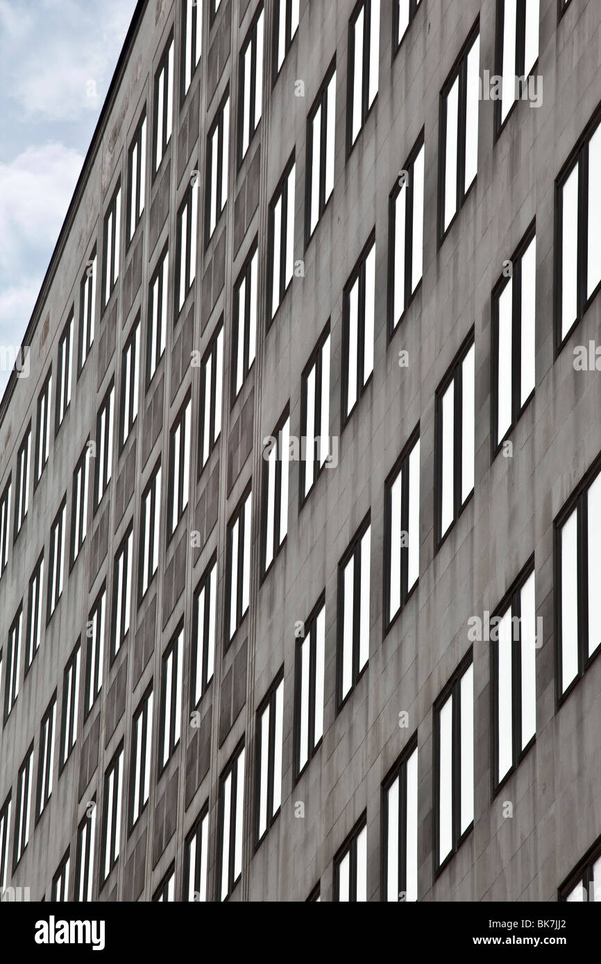 Corner of a grey building or high-rise with many windows Stock Photo ...