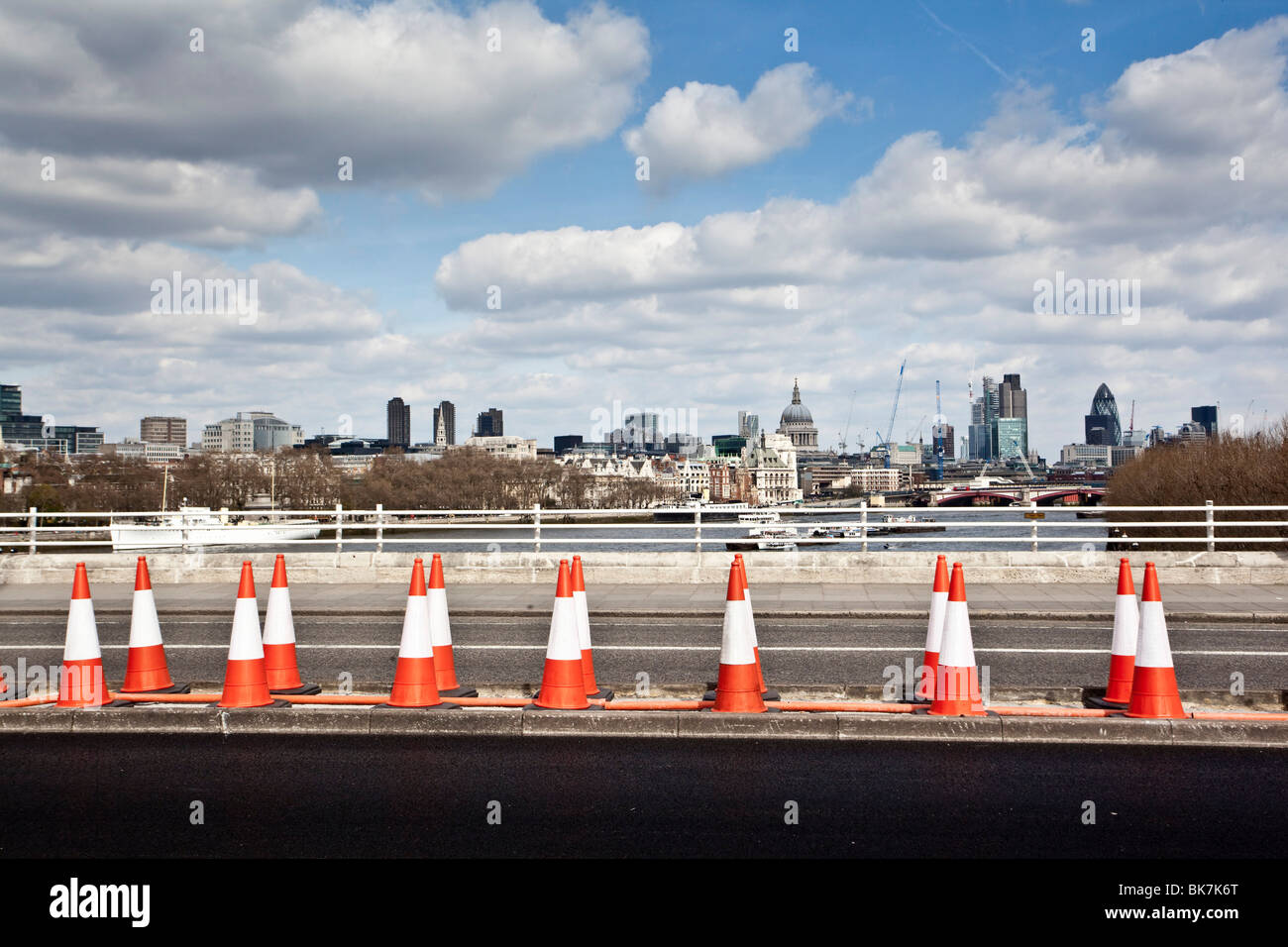 Street cones line London bridge with the city in the background Stock ...