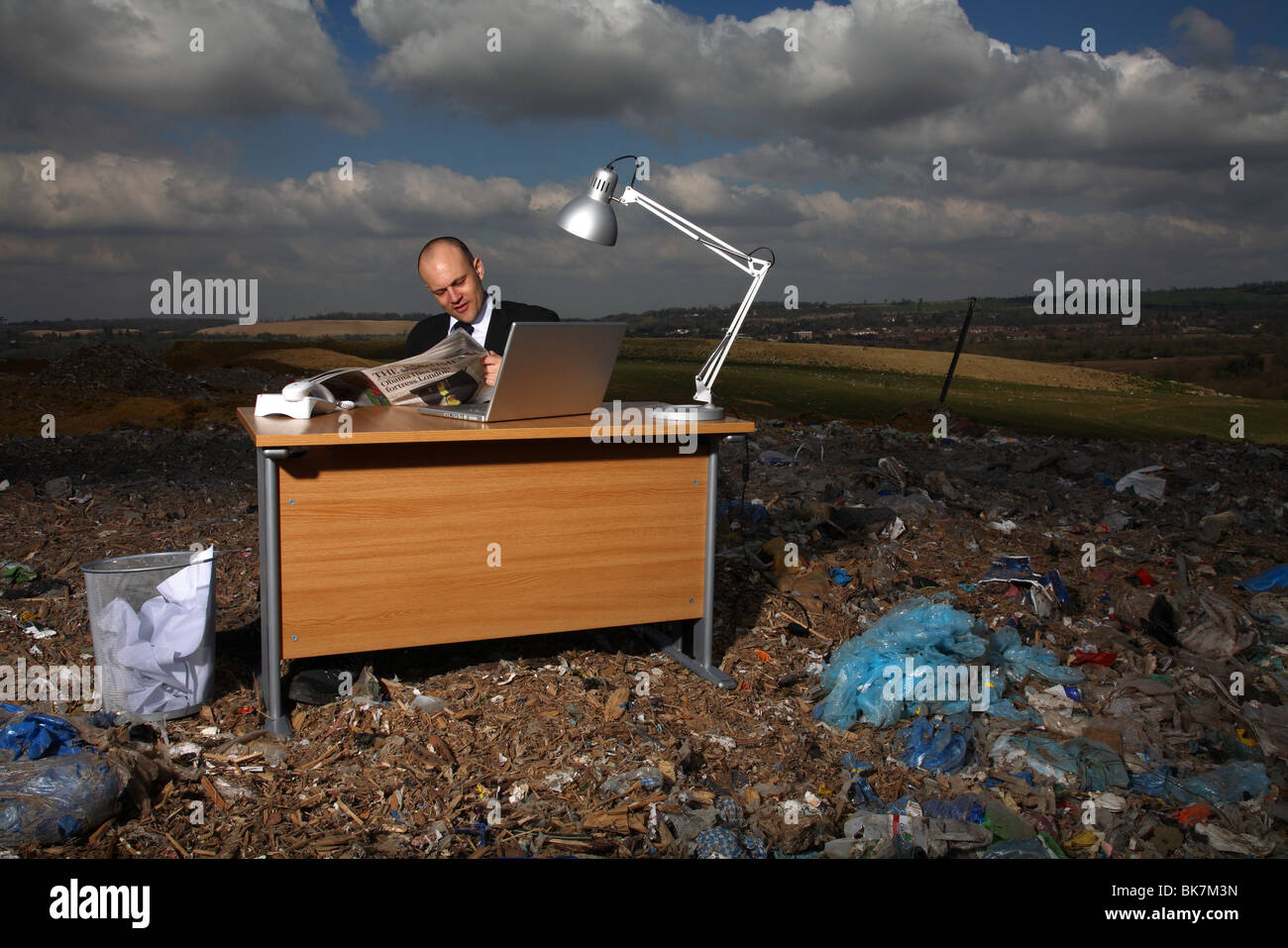 Office worker at desk at British landfill site Stock Photo - Alamy