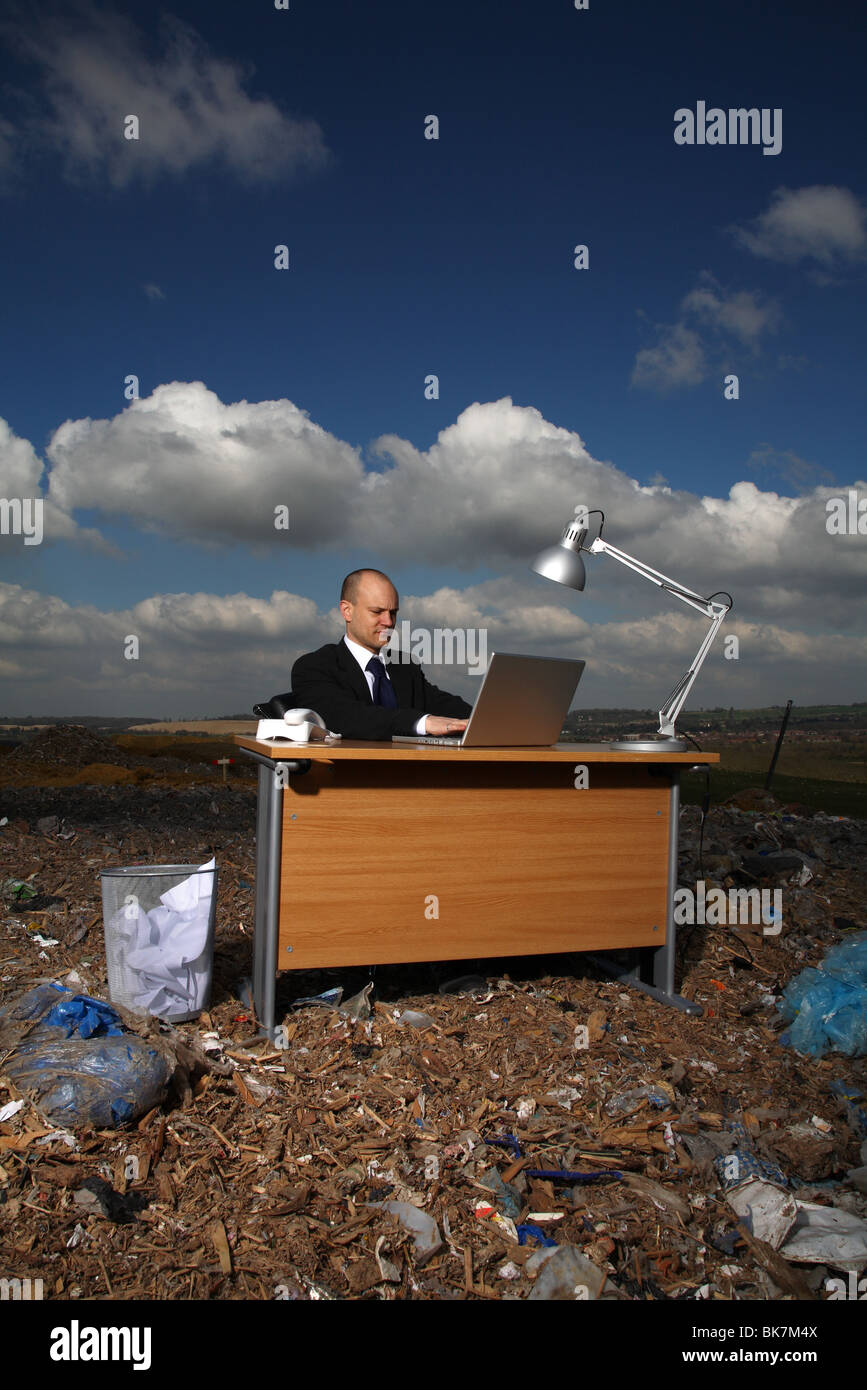 Office worker at desk at British landfill site Stock Photo - Alamy