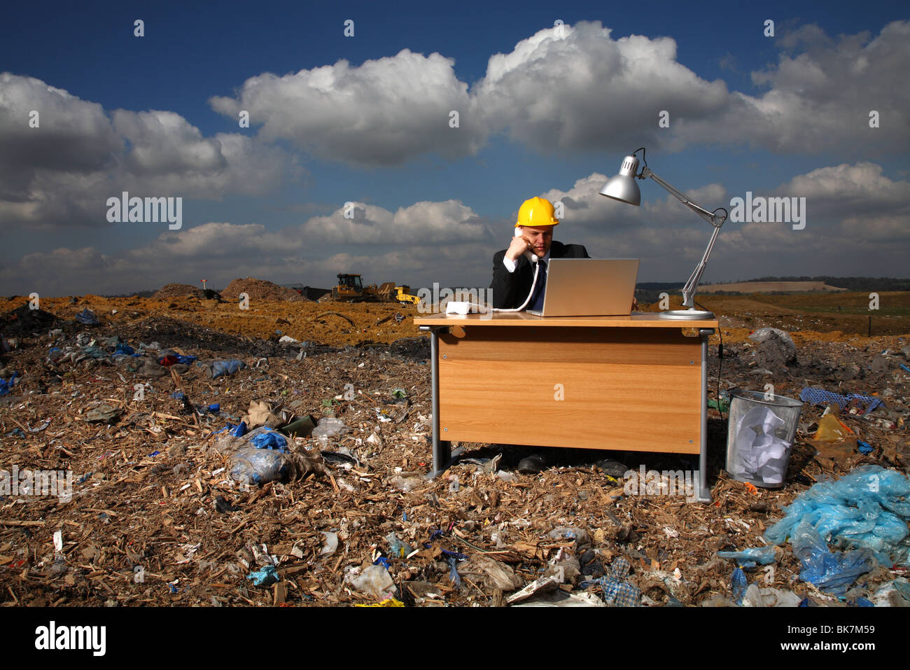 office worker at desk at British landfill site Stock Photo - Alamy