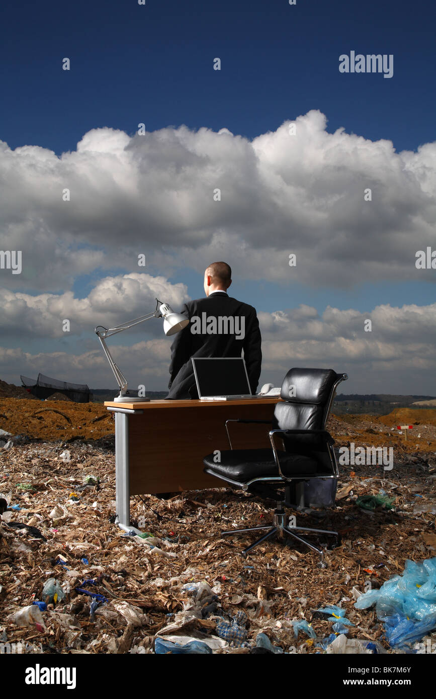 Office worker at desk at British landfill site Stock Photo - Alamy