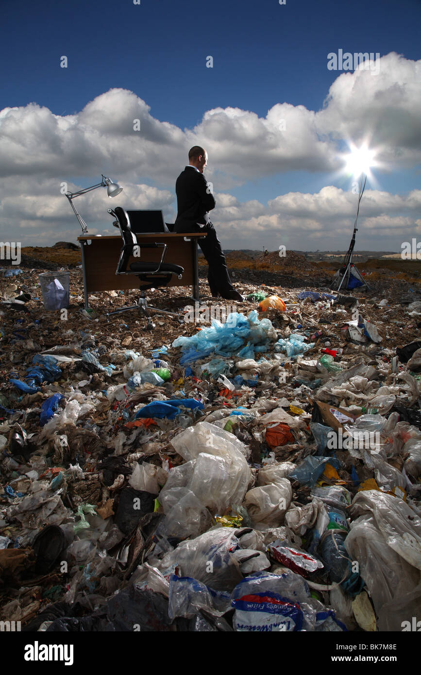 Office worker at desk at British landfill site Stock Photo - Alamy