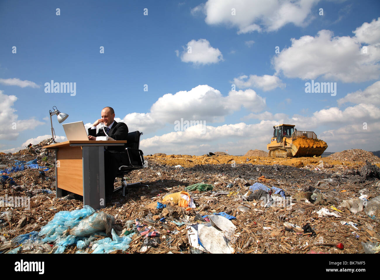 Office worker at desk at British landfill site Stock Photo - Alamy