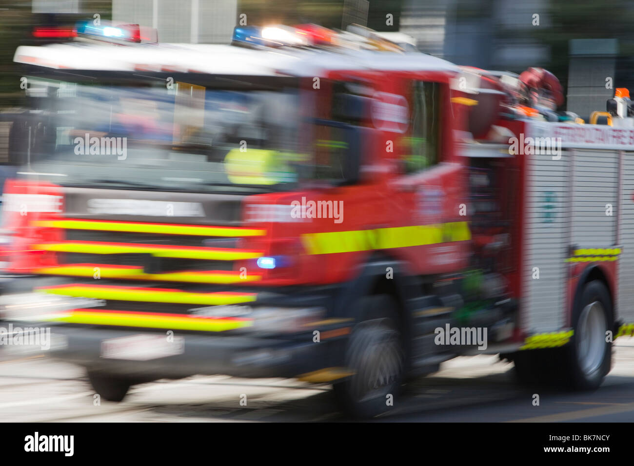 A Melbourne fire engine responding to an emergency in the city centre ...
