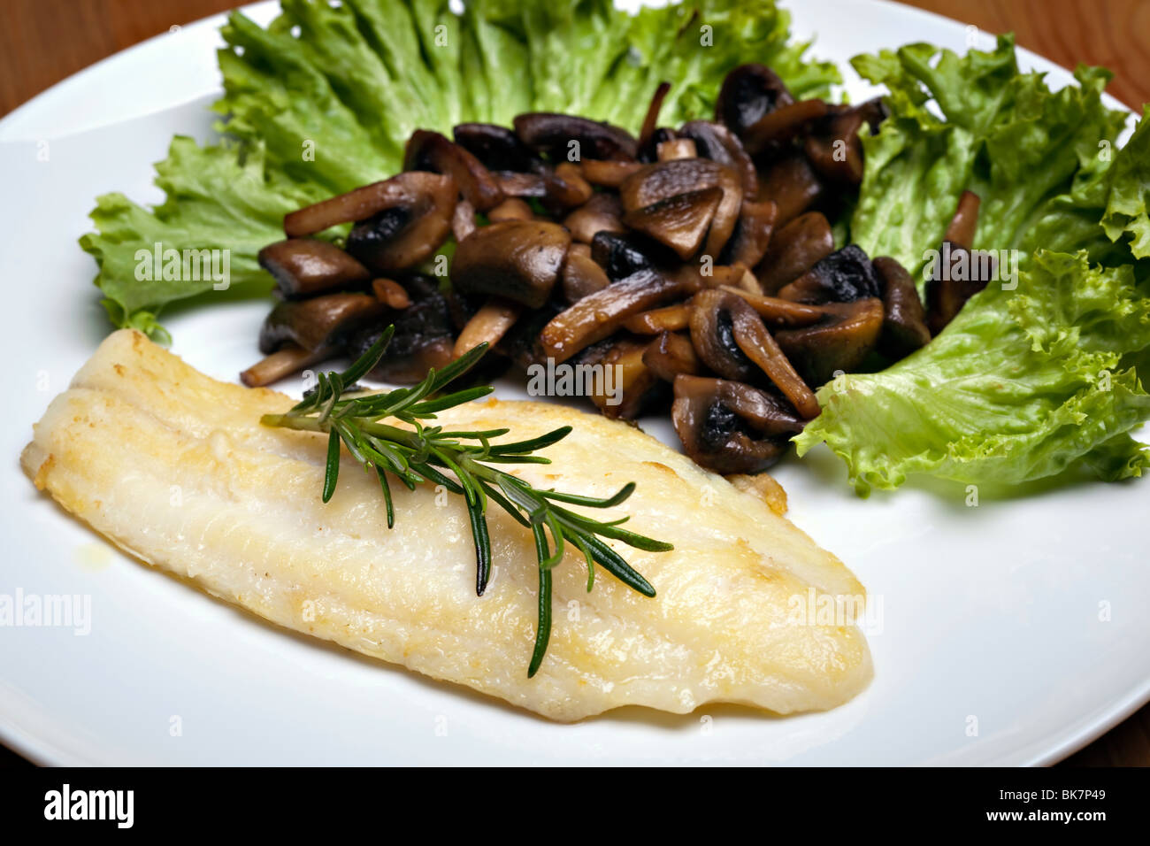 Grilled sole fish with mushrooms and herb Stock Photo - Alamy