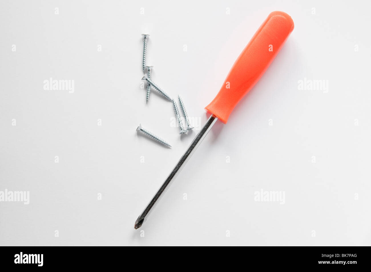 Phillips-head screw driver and screws Stock Photo - Alamy