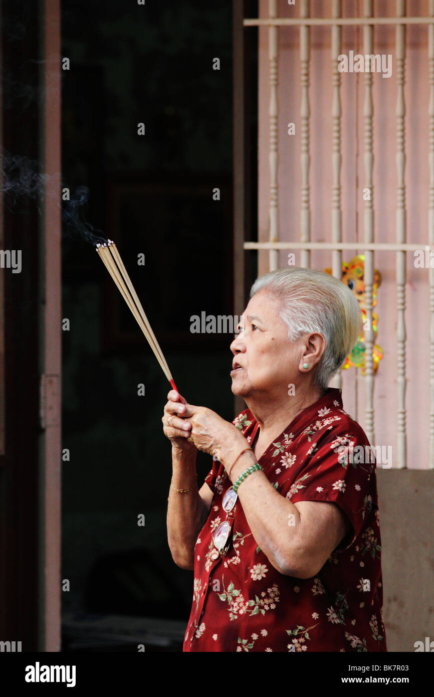 Chinese praying joss sticks penang hi-res stock photography and images ...