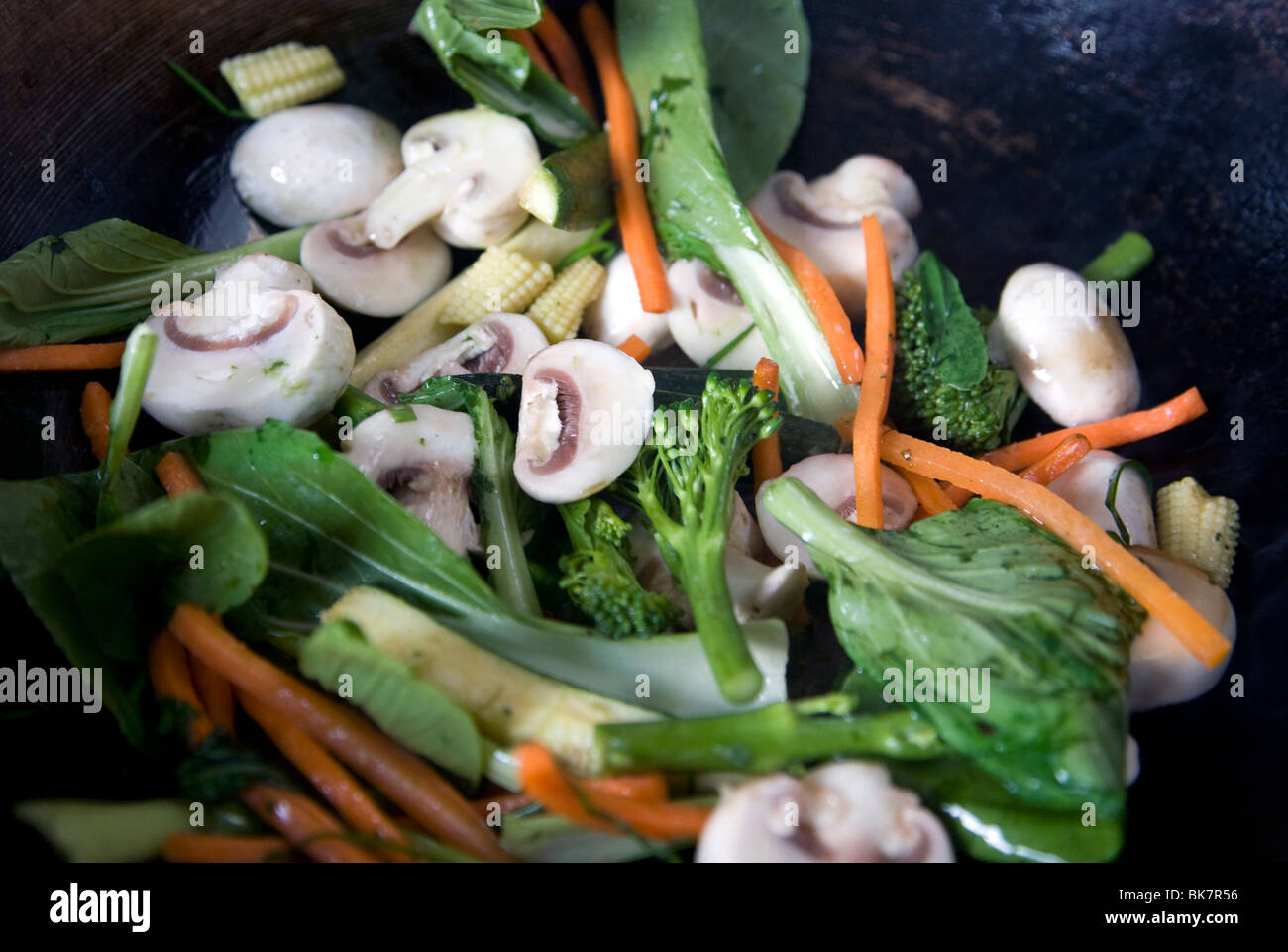 Oriental-style stir fry vegetables in wok Stock Photo - Alamy