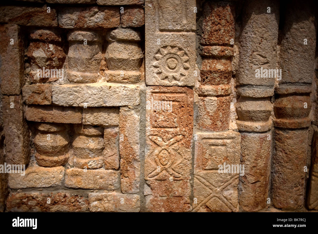 A stone carved pattern covers a wall among the Mayan ruins of Labna ...
