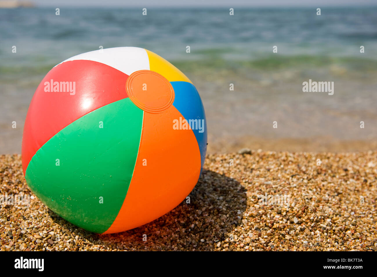 colorful beach ball on nature coast landscape Stock Photo - Alamy