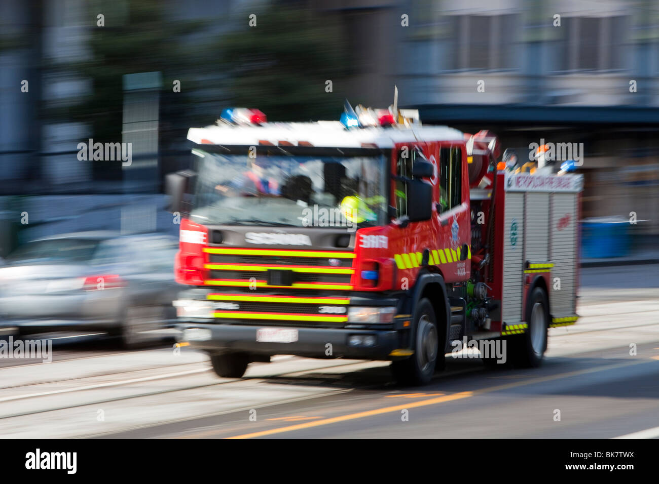 A Melbourne fire engine responding to an emergency in the city centre ...