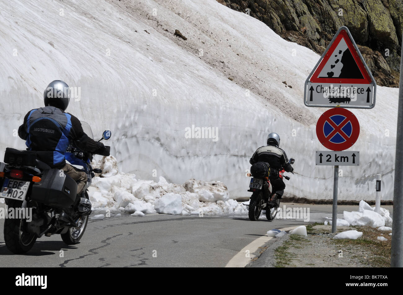 Motorbikes starting descent of Great St Bernard Pass passed huge snow ... Motorbikes starting descent of Great St Bernard Pass passed huge snow ...
