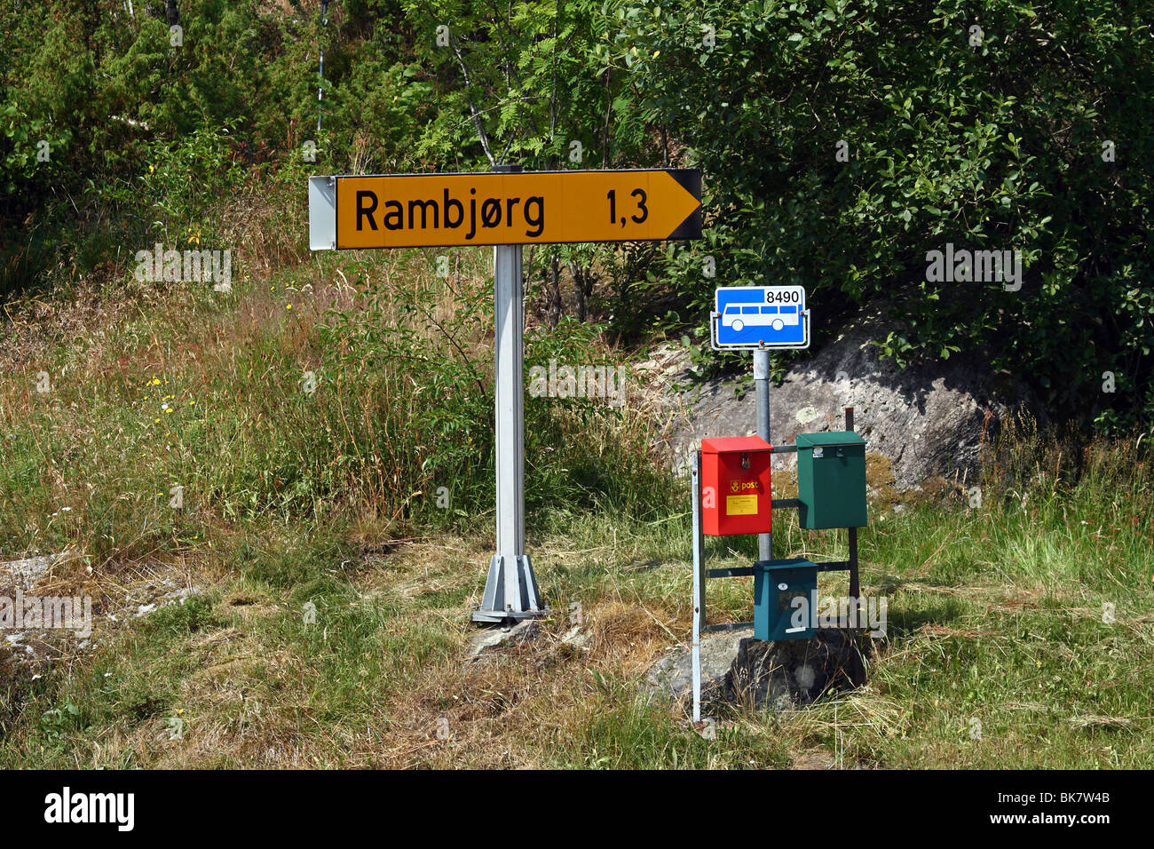 A collection of Norwegian signs and post boxes near Rambjorg, Norway ...