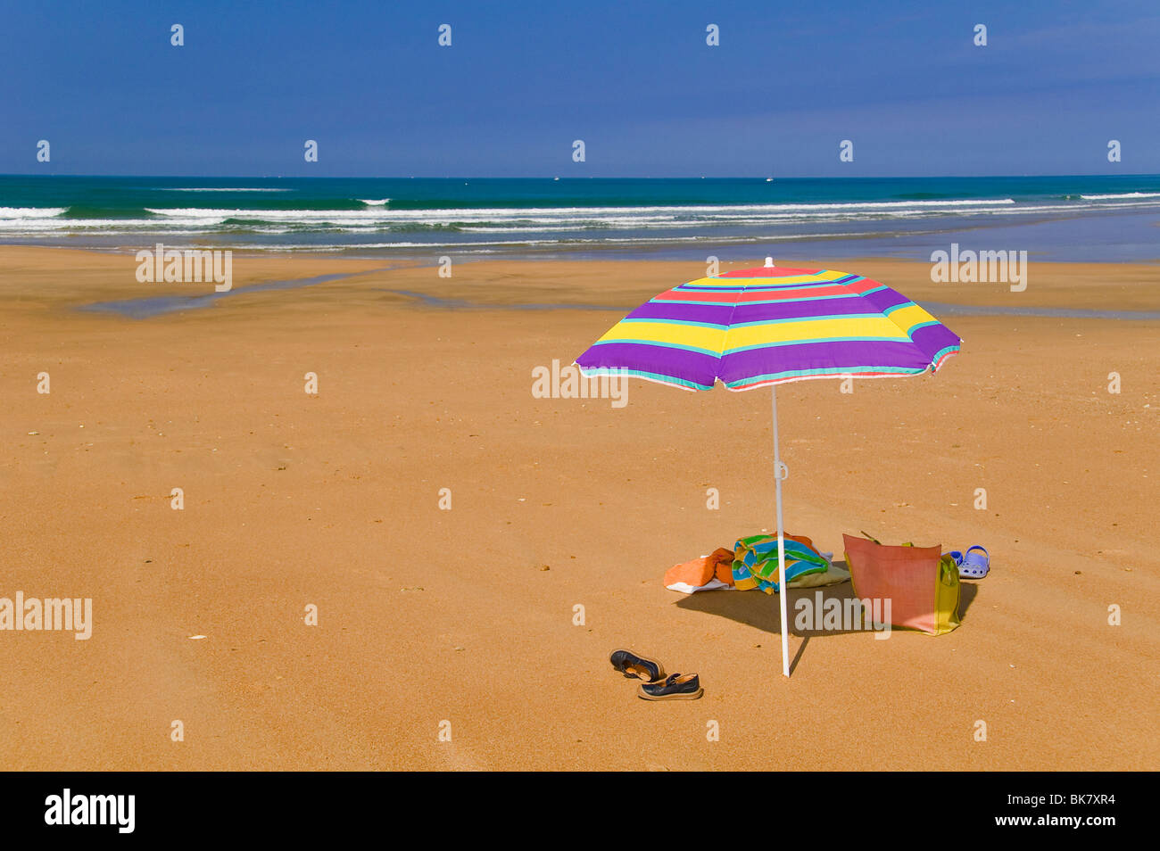 Beach with parasol Stock Photo - Alamy