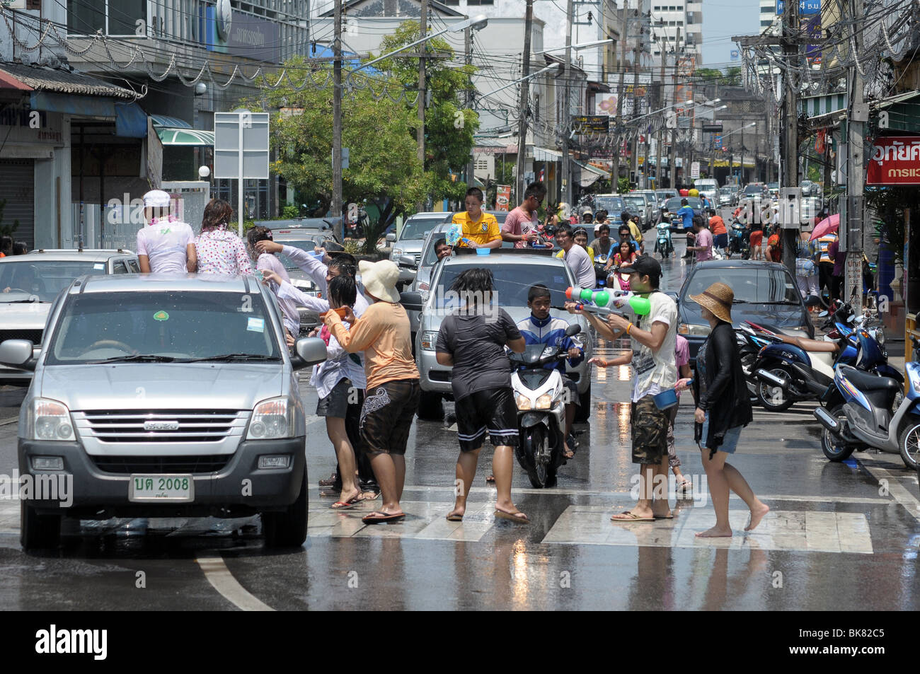 People spraying each other with water in street in Thailand during the ...