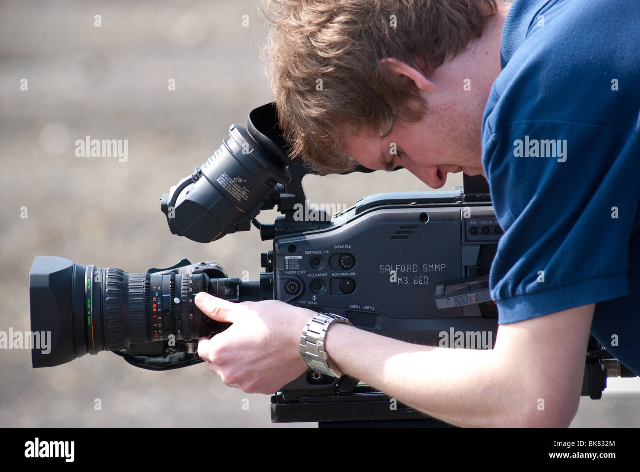 Cameraman with television camera Stock Photo - Alamy