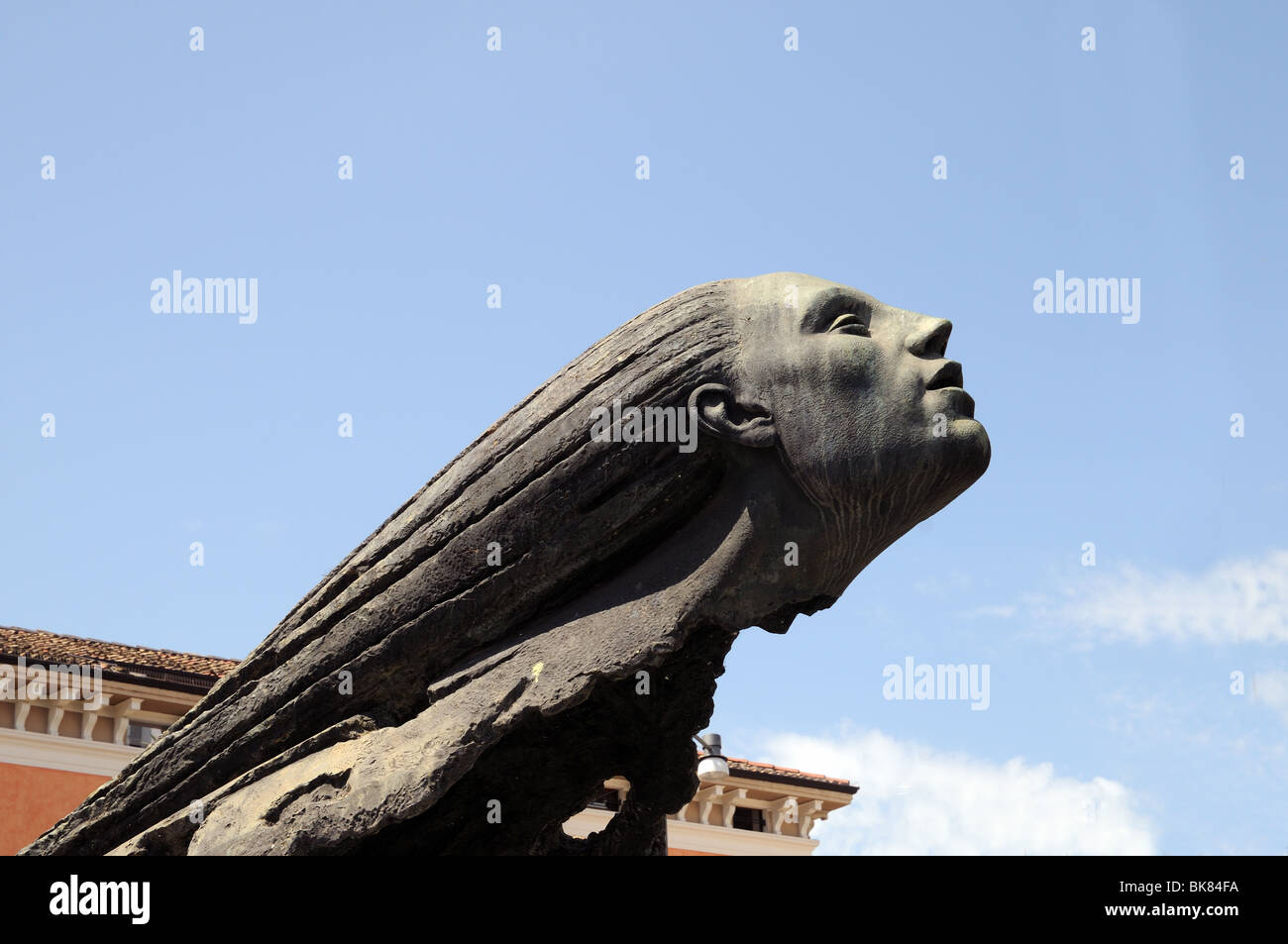 Detail of dramatic stone sculpture of head and speed dedicated to high ...