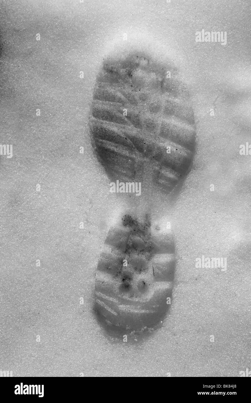 snow white soil with single boot footprint Stock Photo - Alamy