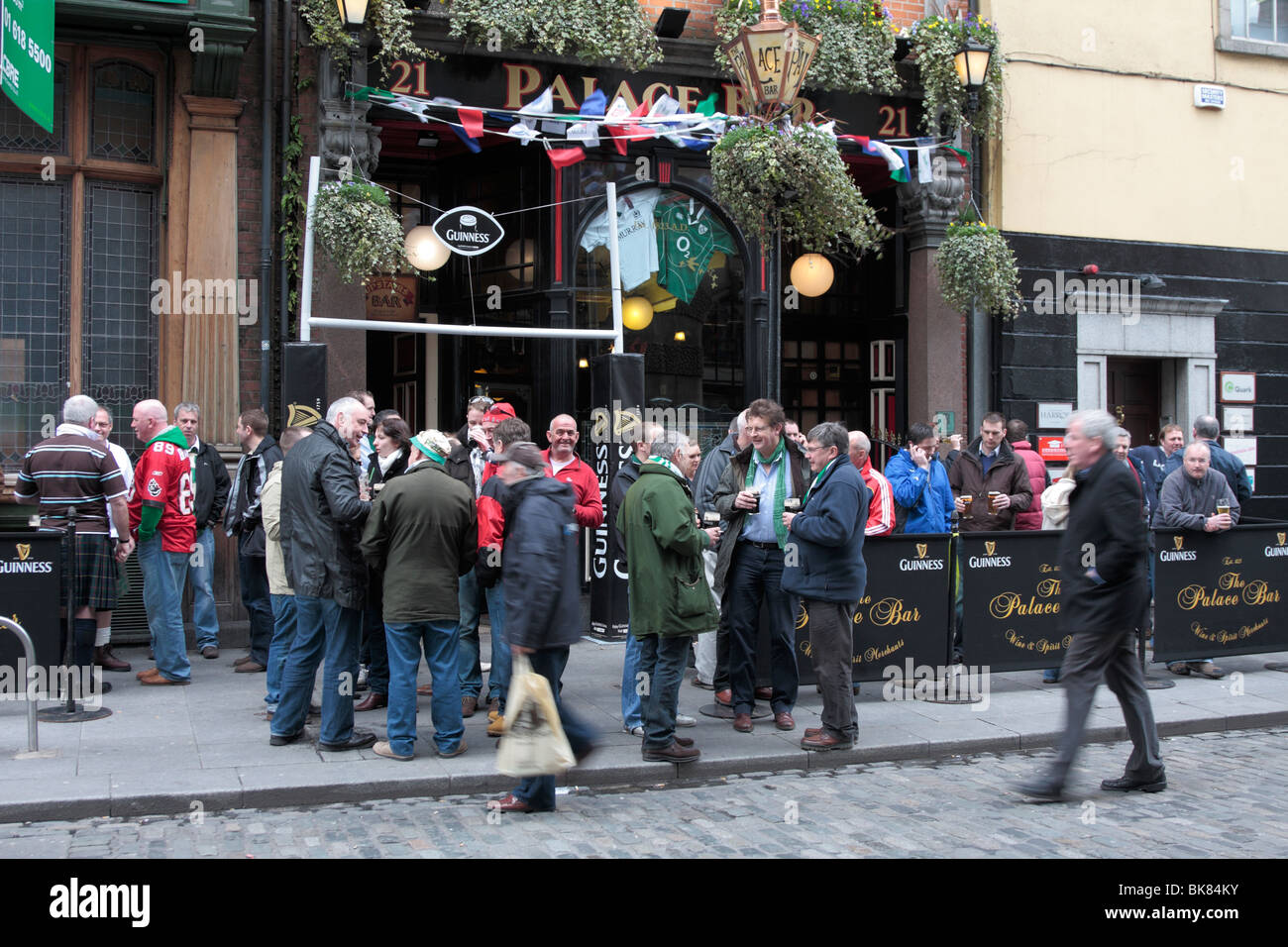 Rugby fans outside the Palace Bar on Fleet Street in Dublin havig a ...