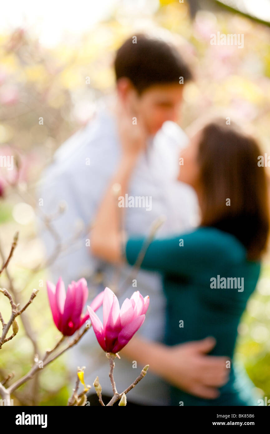 pink flower, couple, kissing Stock Photo - Alamy