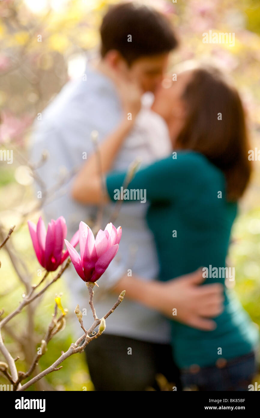 pink flower, couple, kissing Stock Photo - Alamy
