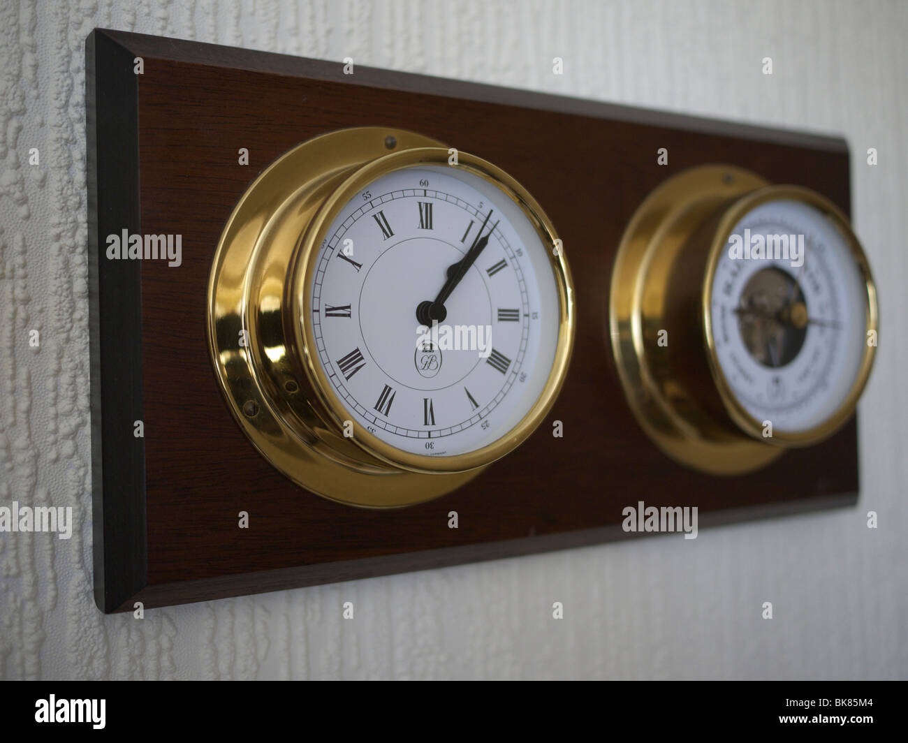 Clock and Barometer on wooden plinth Stock Photo - Alamy
