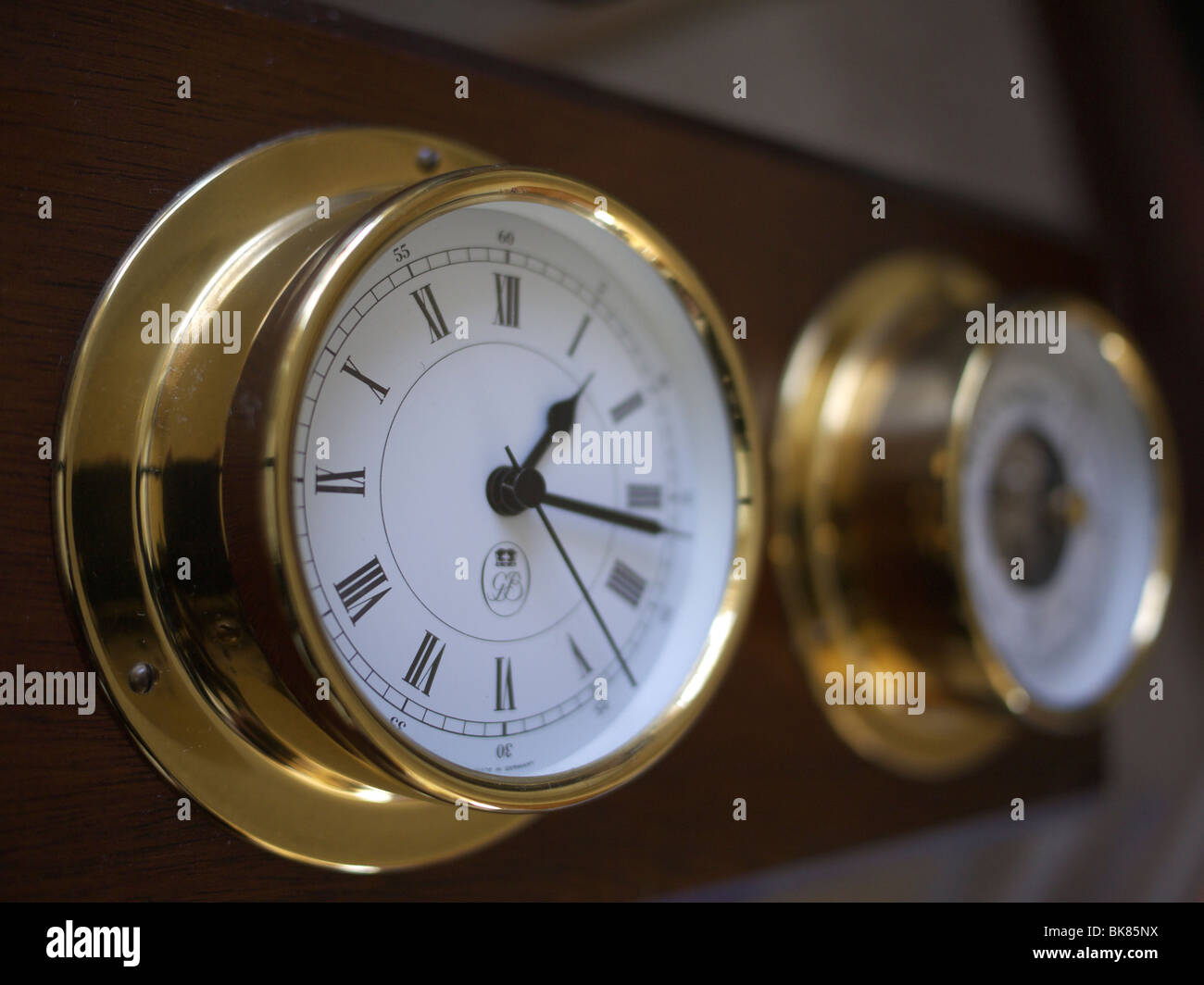 Clock and Barometer Stock Photo - Alamy