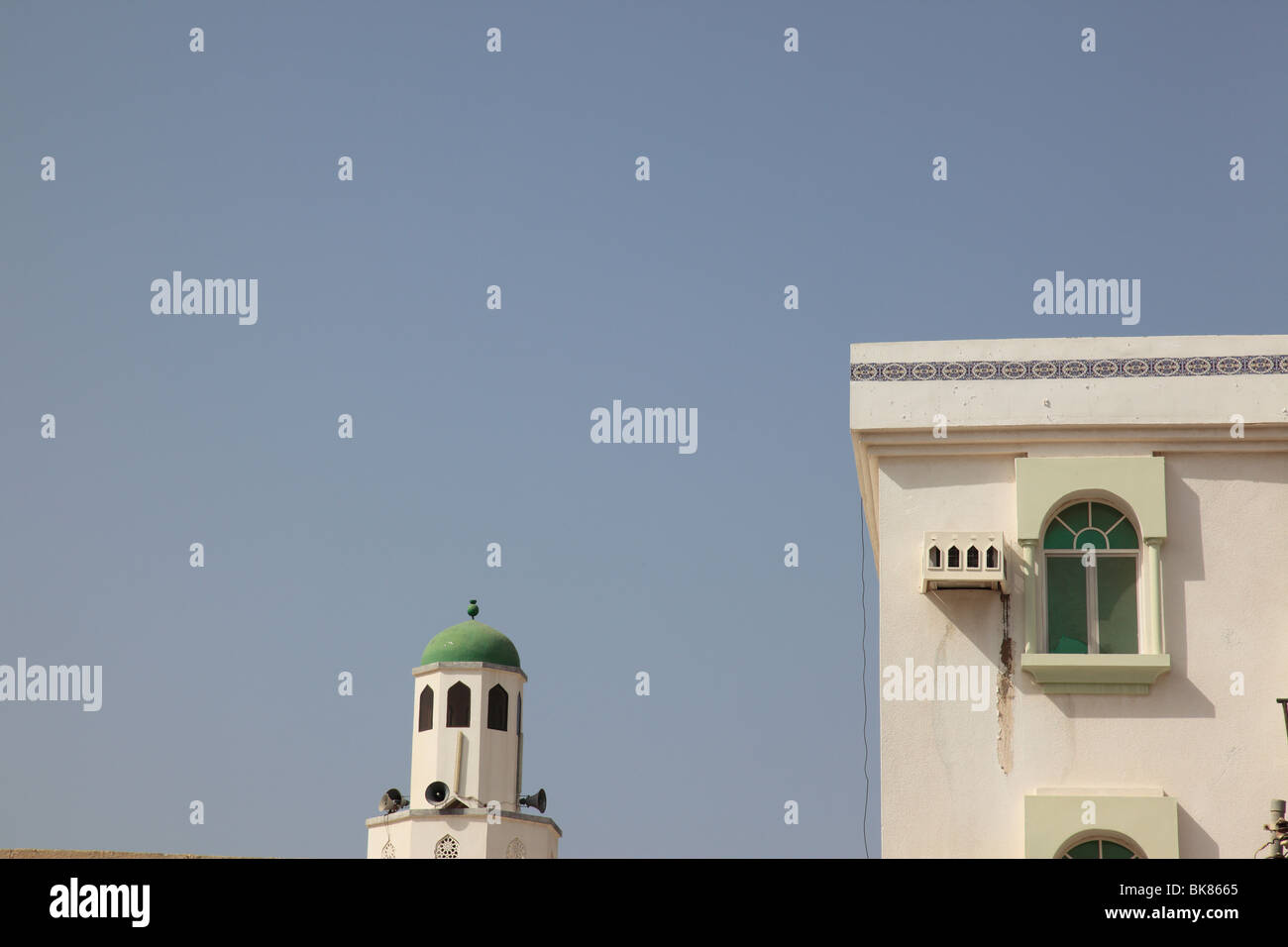 minaret and corner of a building at Muscat Sultanate of Oman. Photo by ...