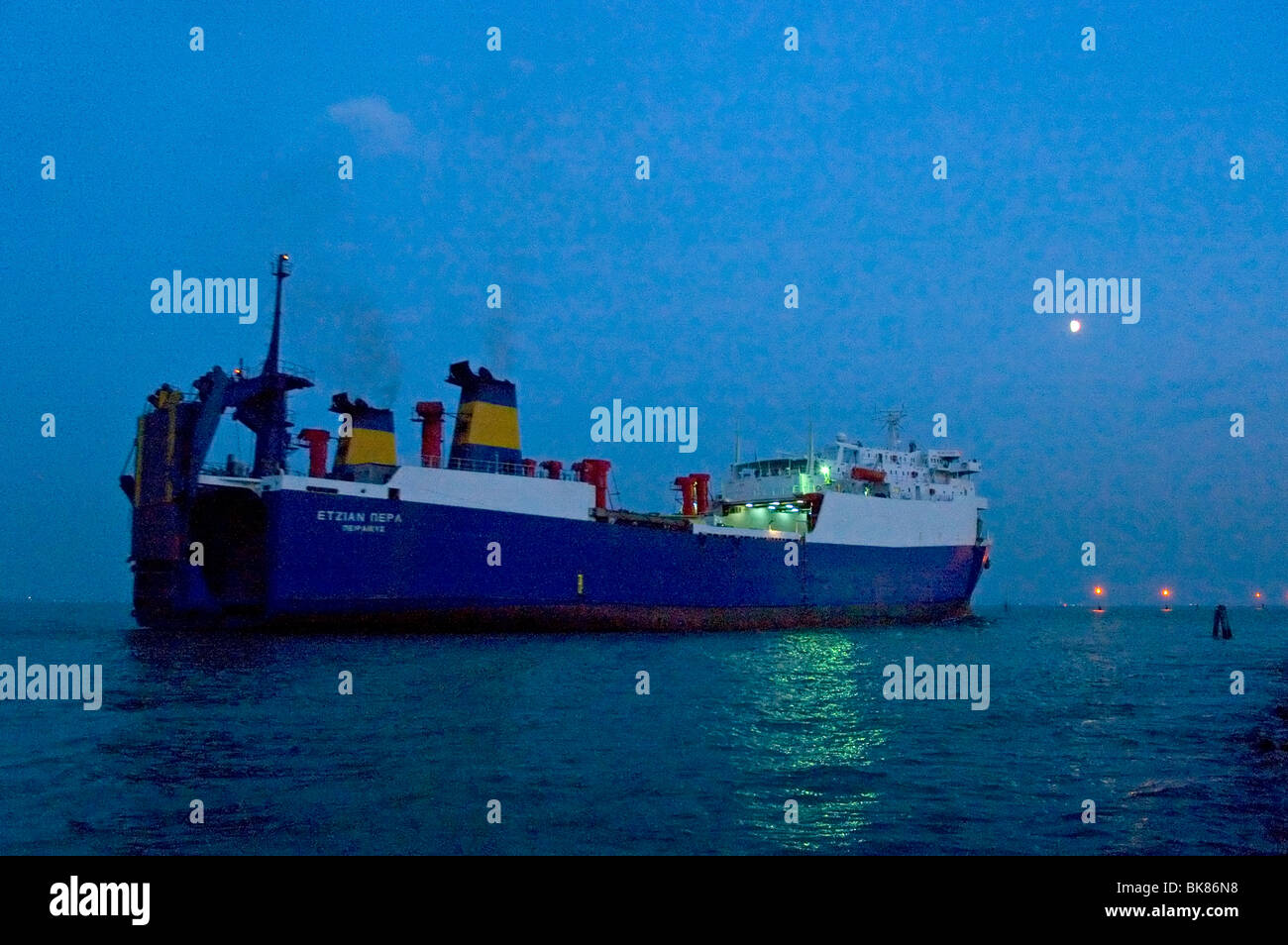 Cargo Ship by Moonlight Stock Photo - Alamy