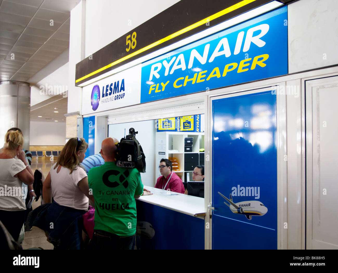 Passengers at Ryanair office in Gran Canaria arport being filmed by ...