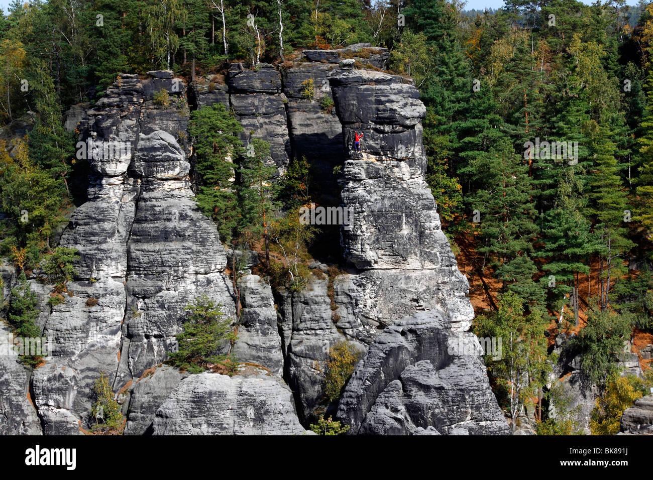 Rocks in the Elbe Sandstone Mountains in autumn, with climbers, The ...
