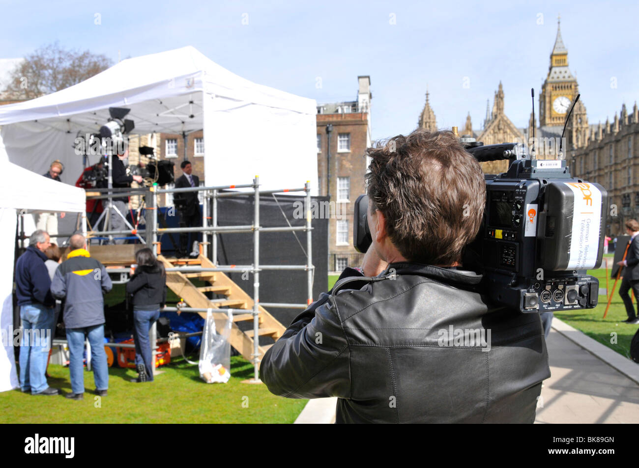 German TV news camerman filming the BBC interview podium outside ...