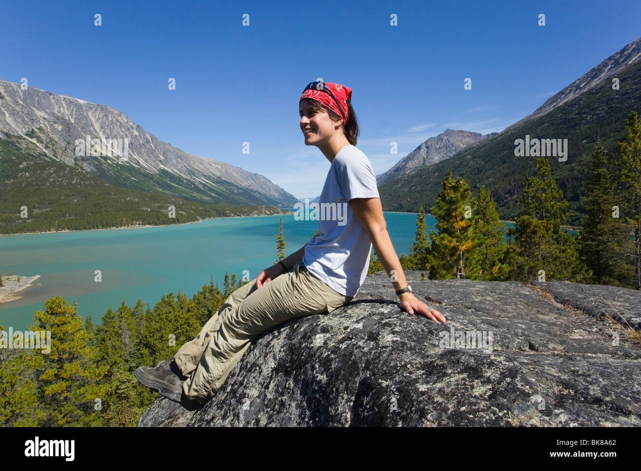 Woman resting on rocky stone hi-res stock photography and images - Alamy
